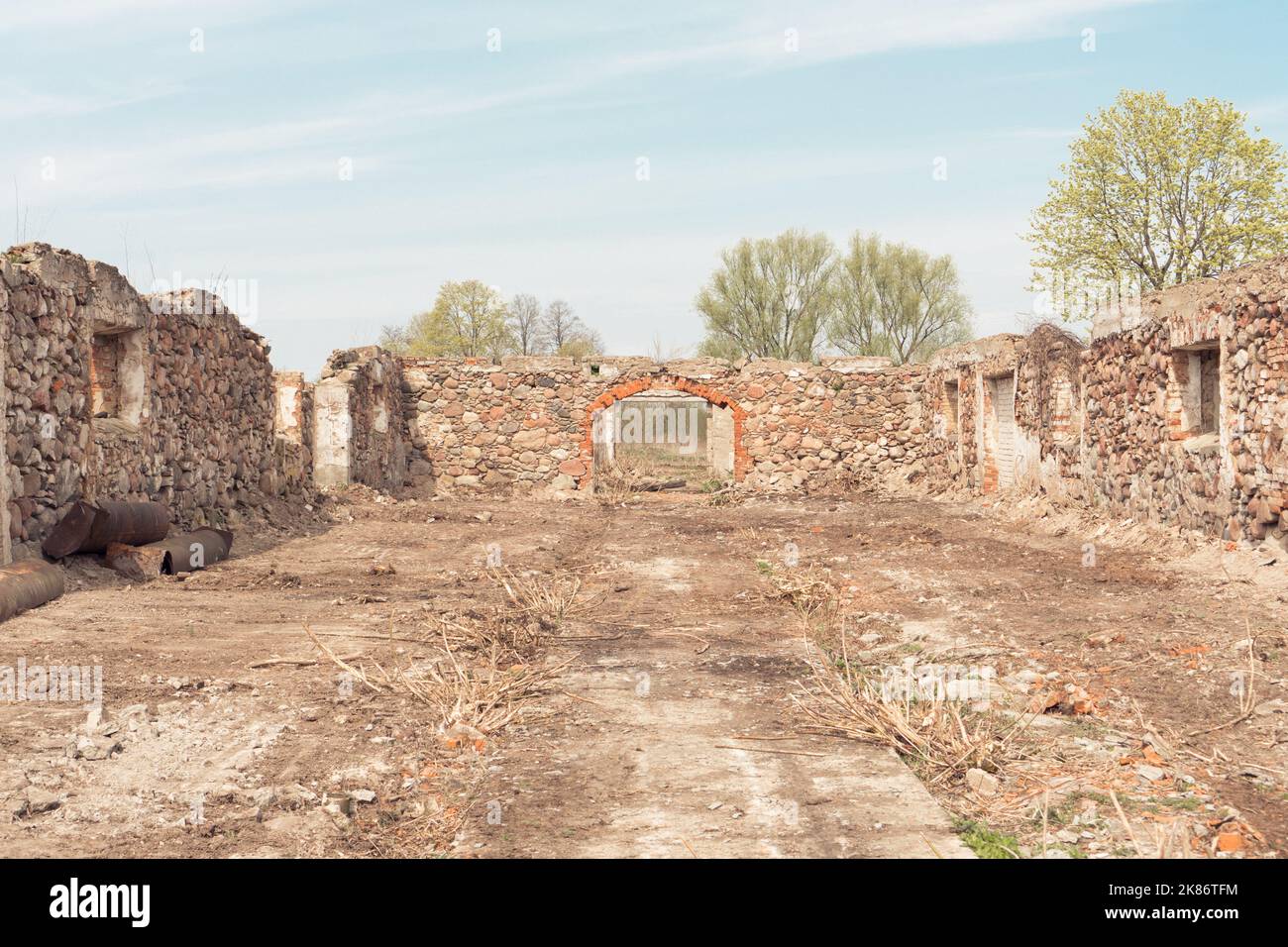 Old partially destroyed building of vintage hangar or warehouse without ...