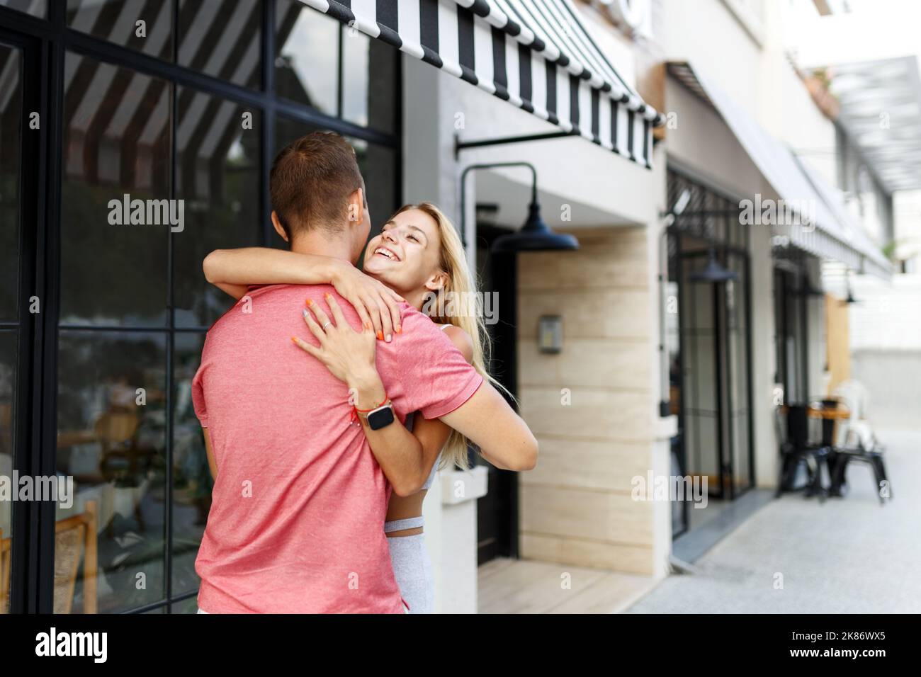 Farewell concept. Delighted happy smiling blonde woman says goodbye or ...