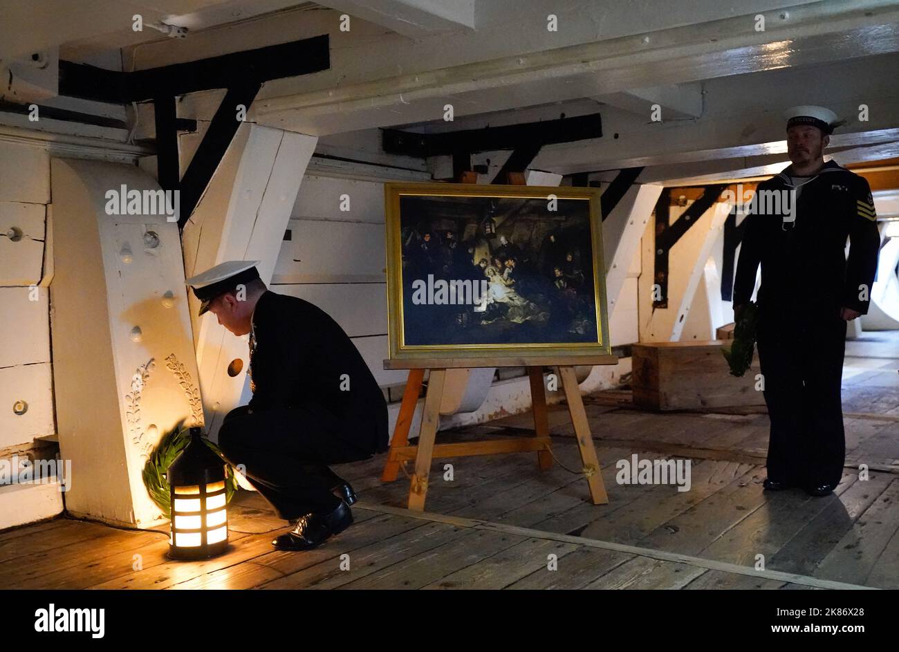 Second Sea Lord Vice-Admiral Martin Connell (left) lays a wreath on the ...