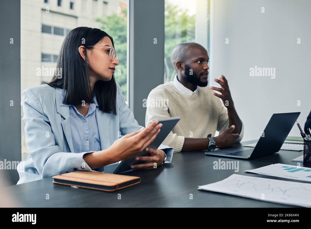 I think changing the way we work has helped. two work colleagues ...