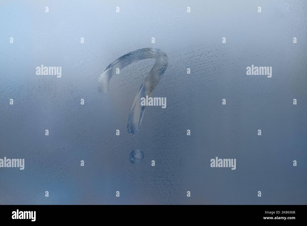 Doubt and choice concept. Question mark on matte misted glass ...