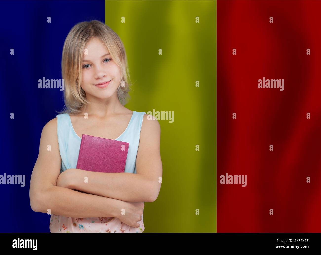 Pretty teen girl student smiling against Romanian flag background Stock ...