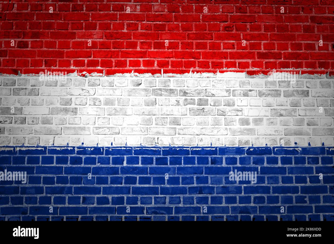 An image of the Netherlands flag painted on a brick wall in an urban ...