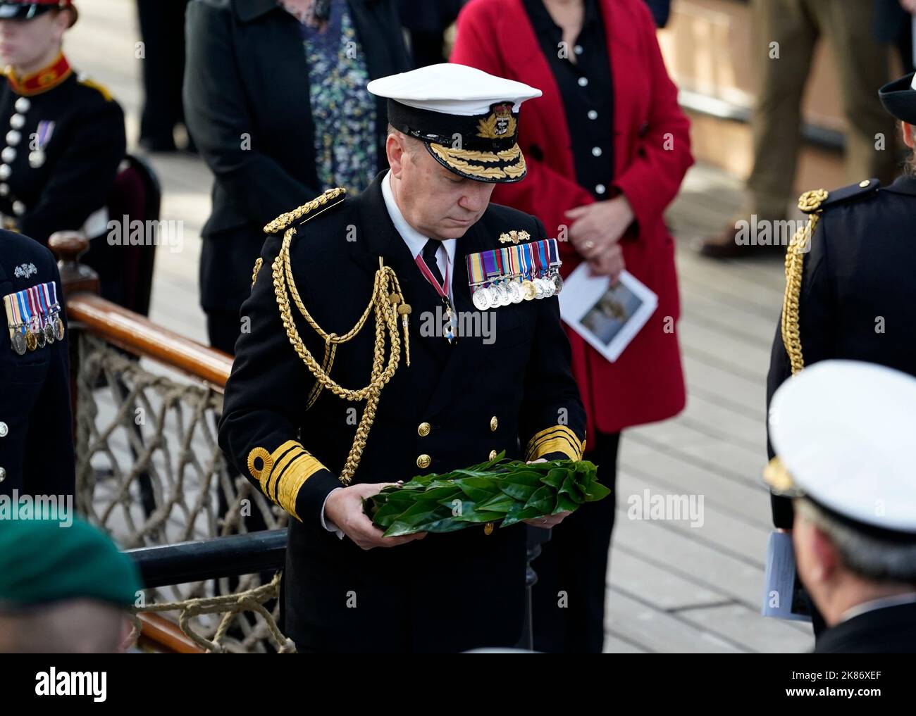 Second Sea Lord Vice-Admiral Martin Connell (left) lays a wreath at the ...