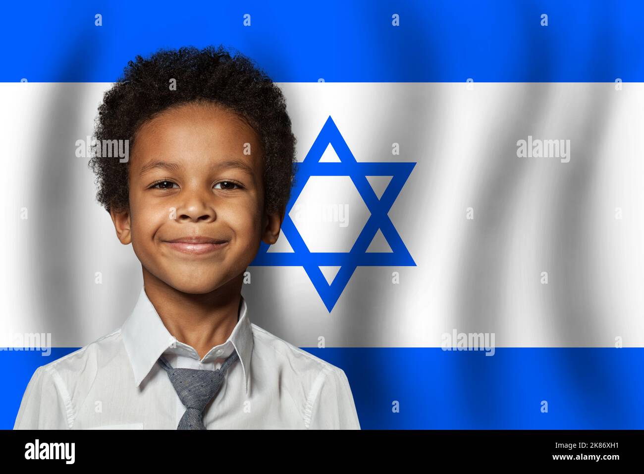 Israeli kid boy on flag of Israel background. Education and childhood ...