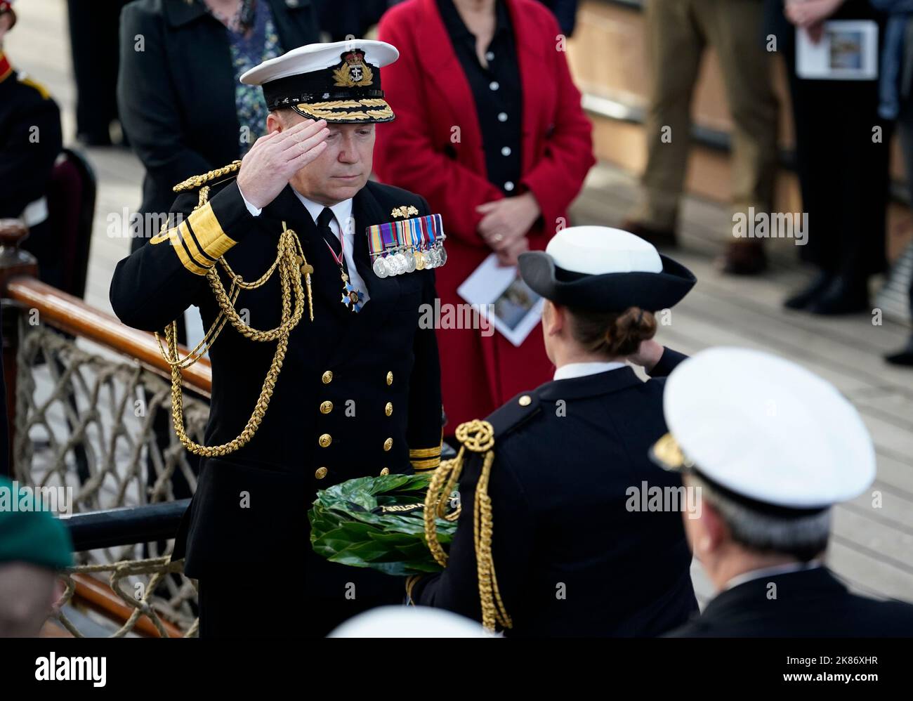 Second Sea Lord Vice-Admiral Martin Connell (left) receives a wreath to ...