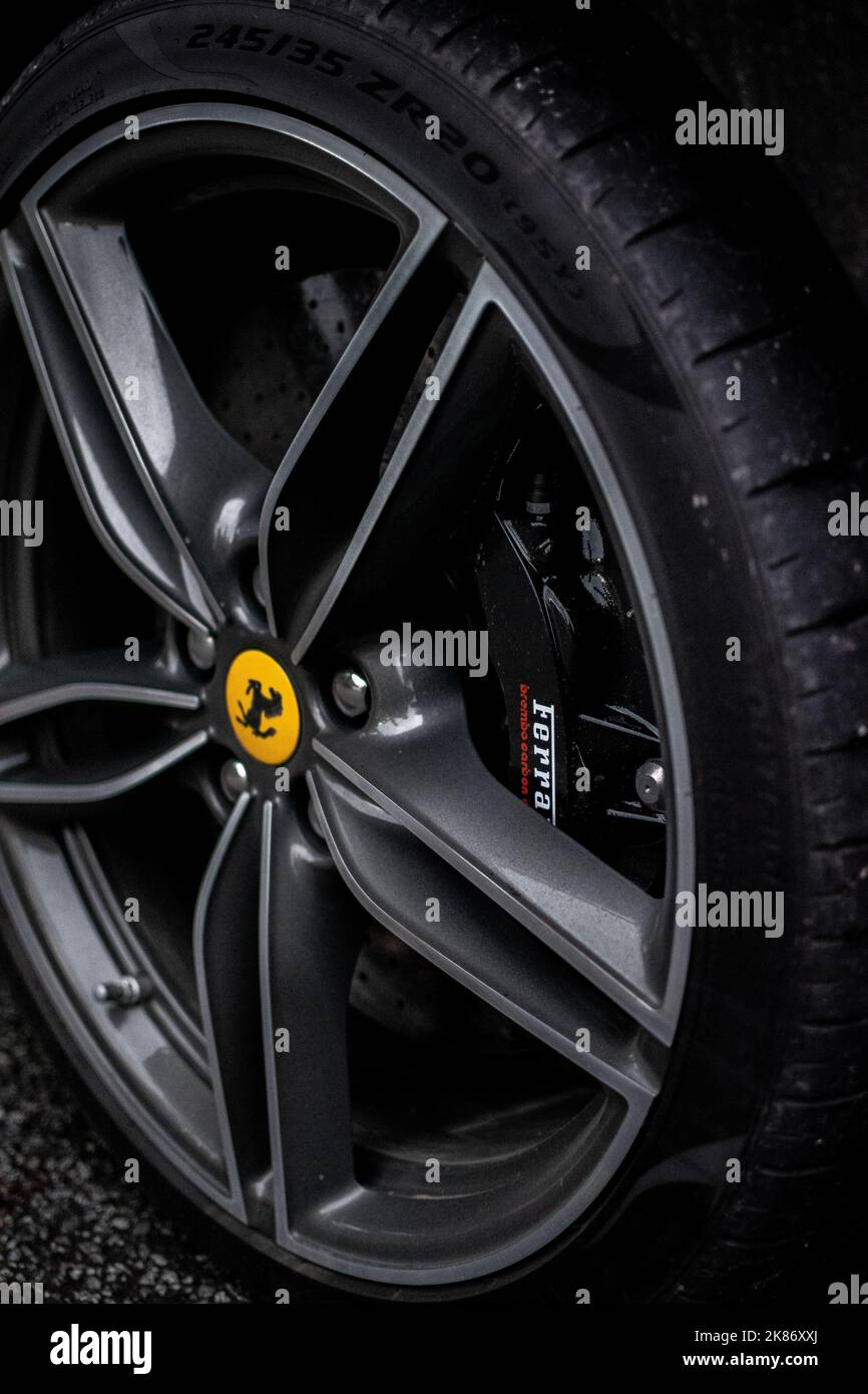A vertical closeup of a black Ferrari wheel in Hale Village, United ...