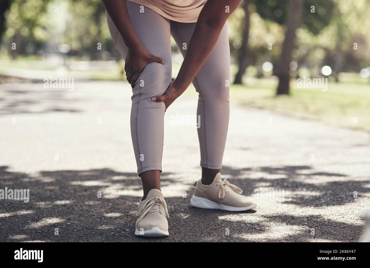 This leg injury is seriously ruining my run. a woman massaging an ...