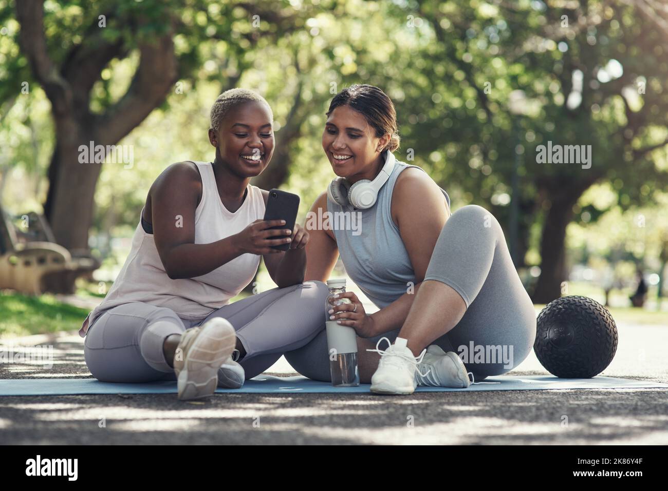 I have to show this picture. two female friends taking a break to use a ...