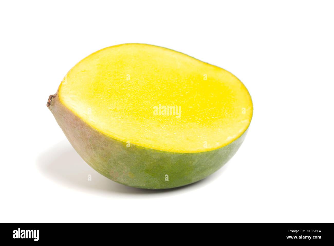 chopped half of ripe mango fruit isolated on white background Stock ...