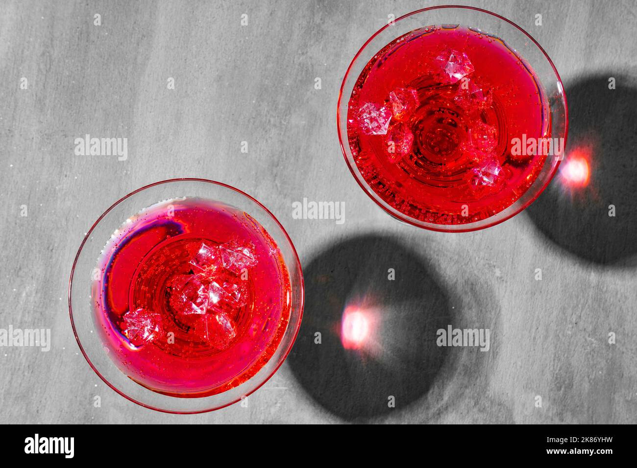 Cold pink cocktail on concrete background close up Stock Photo - Alamy