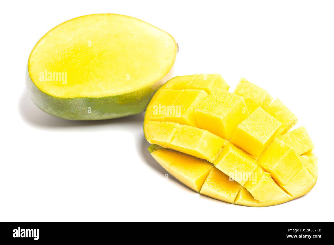 chopped half of ripe mango fruit isolated on white background Stock ...