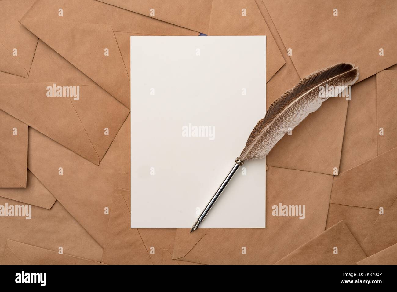 Pile of blank craft envelopes on table close up Stock Photo - Alamy