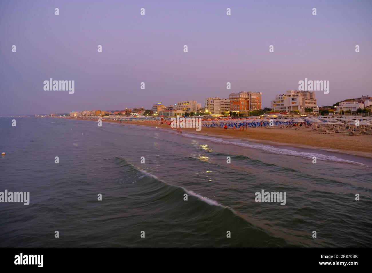 Coastline and city skyline at sunset in Senigallia, Marche, Italy. City ...