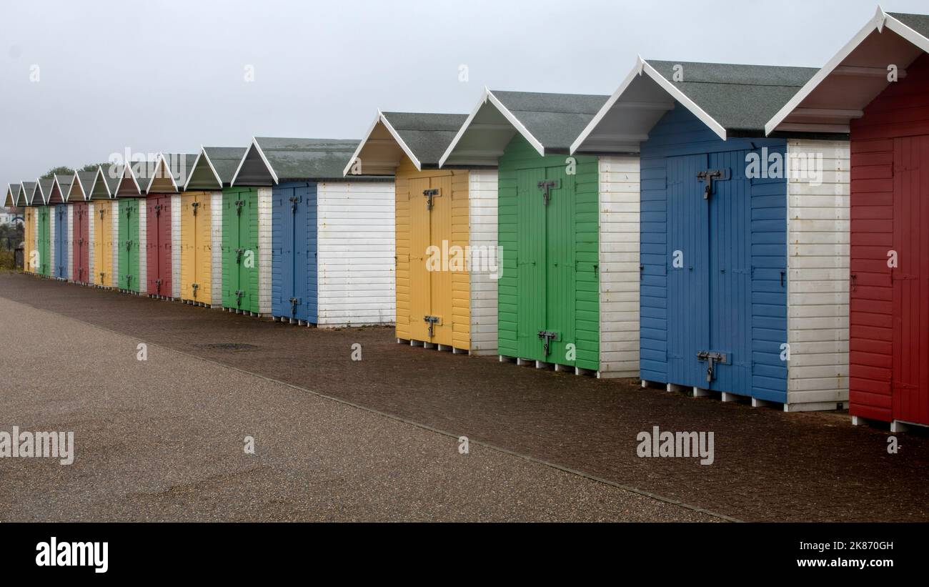 A row of beautiful wooden huts painted green, red, yellow and blue at ...
