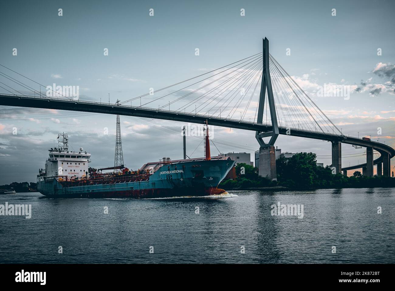 A Vessel infront of a Big Bridge Stock Photo - Alamy