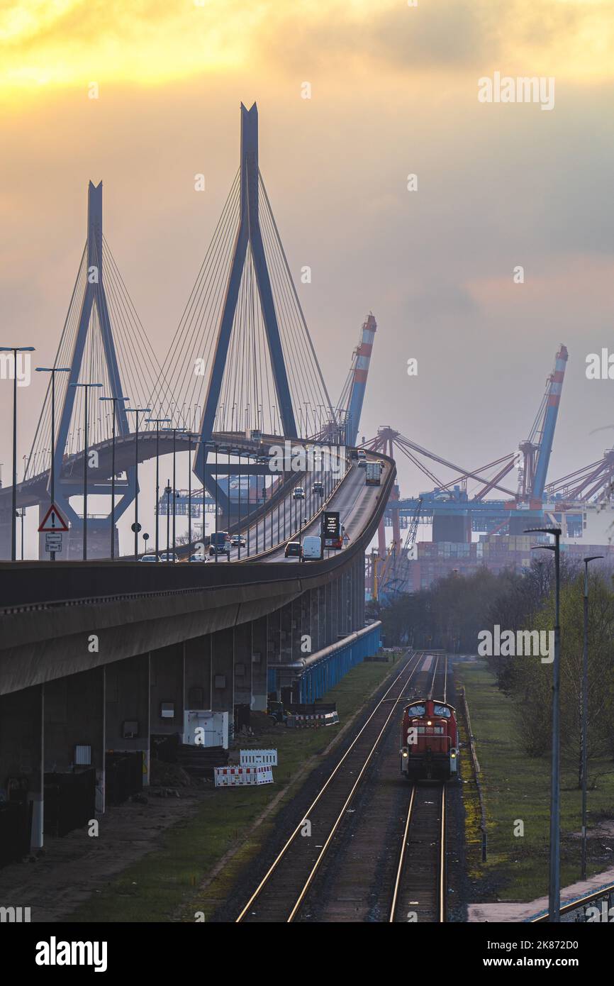 a Huge Bridge in the Harbour with a Locomotive Train leaving the Yard ...