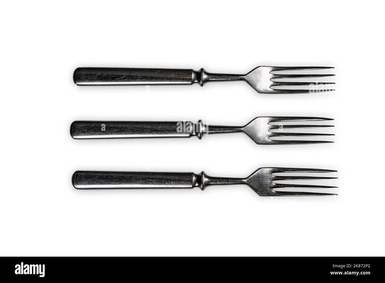 Silver forks on white background Stock Photo - Alamy