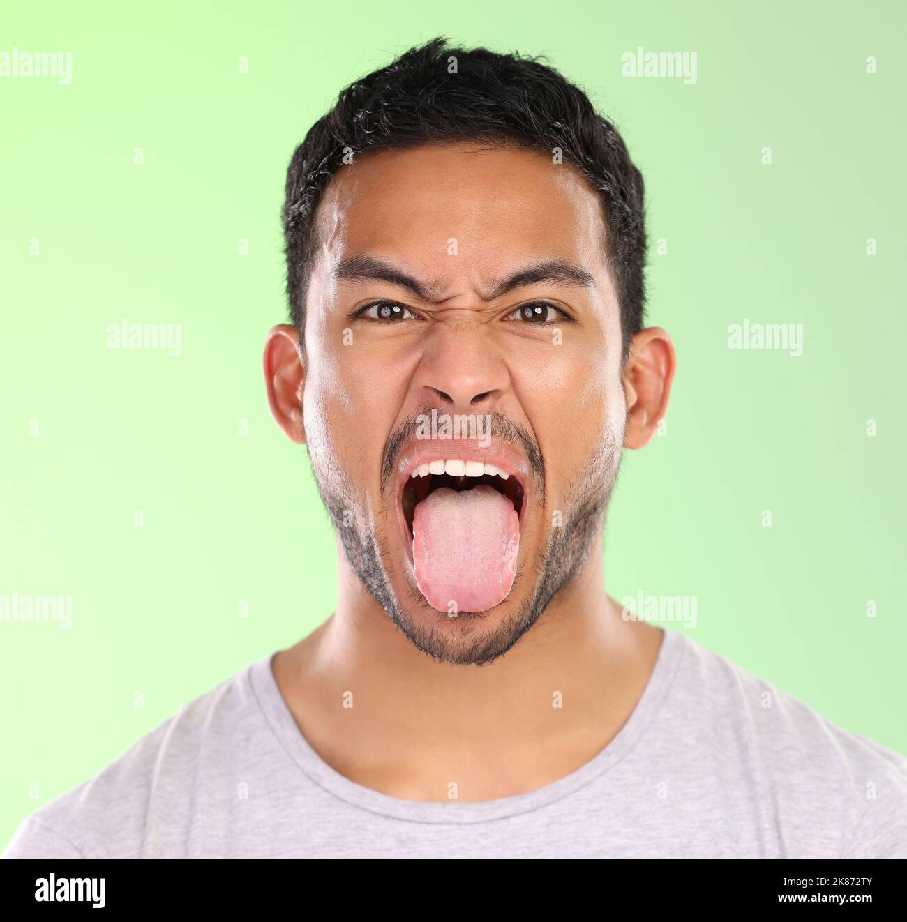 Hes got a wild side. Cropped portrait of a handsome young man making a ...