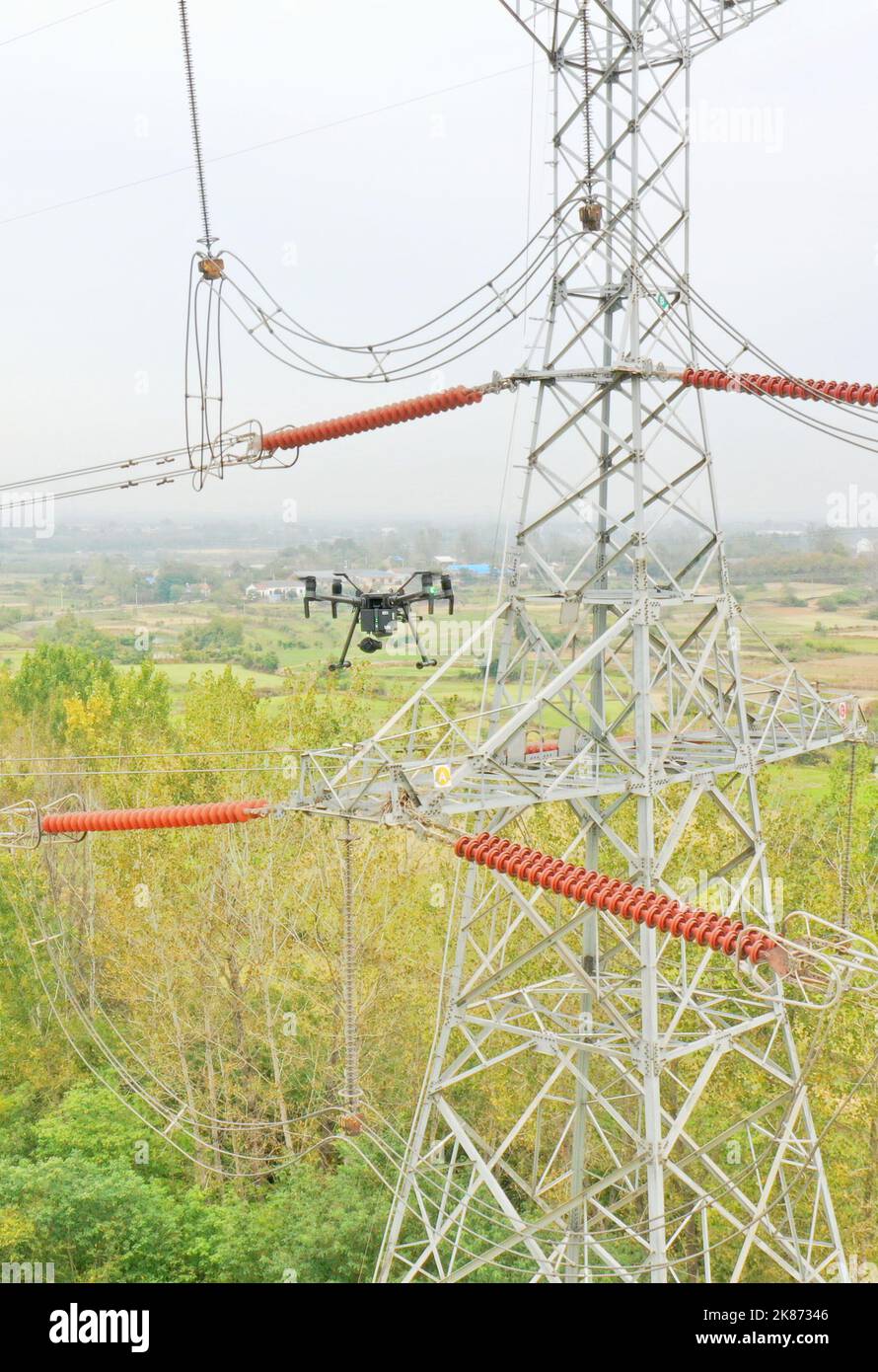 CHUZHOU, CHINA - OCTOBER 21, 2022 - Electric power employees use drones ...