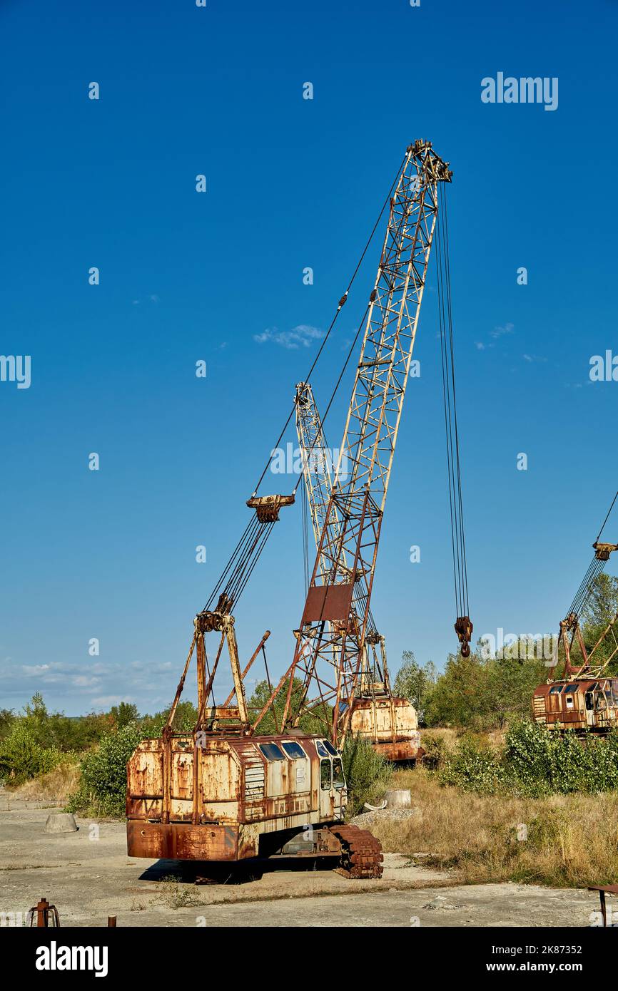 Rusty cranes in an abandoned hydrotechnical construction site Stock ...