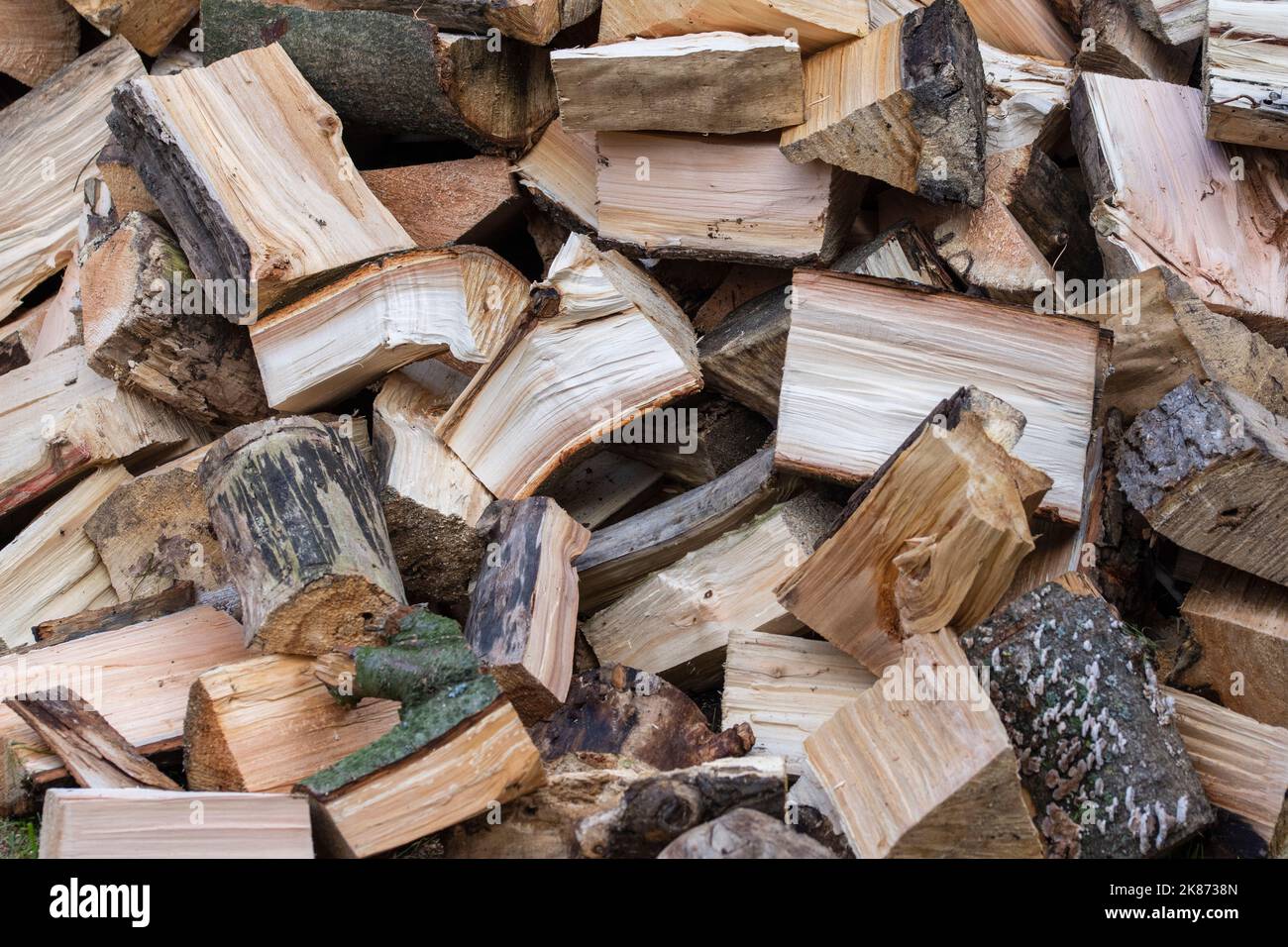 Tree trunks cut and chopped in a heap ready to be laid Stock Photo - Alamy