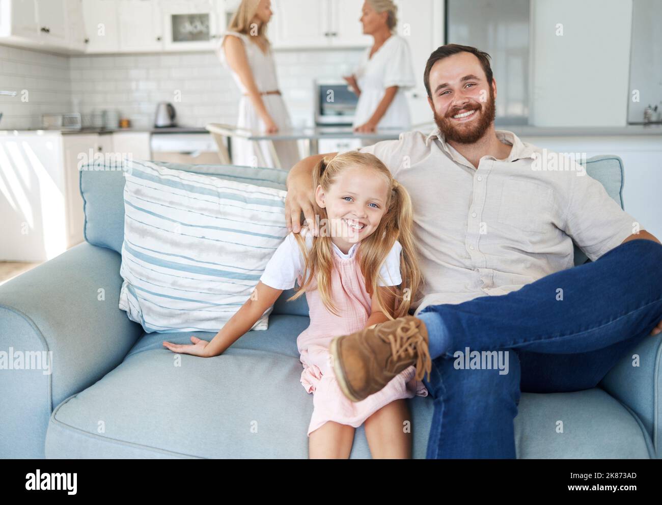 Relax, father and child on the sofa in the living room of their house ...