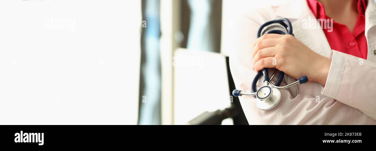 Female doctor stand holding stethoscope equipment in hand, schedule ...