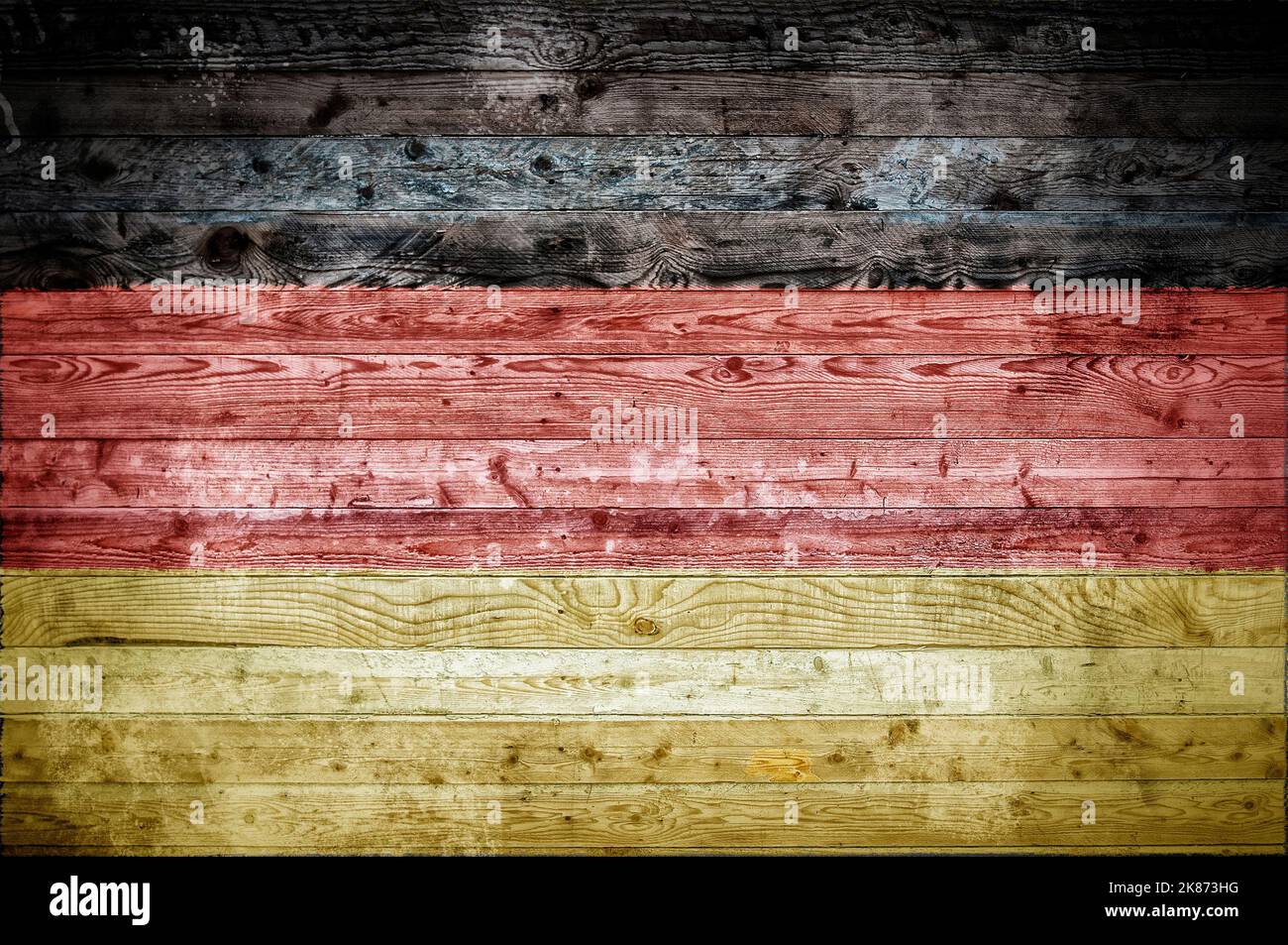 A vignetted background image of the flag of Germany painted onto wooden ...