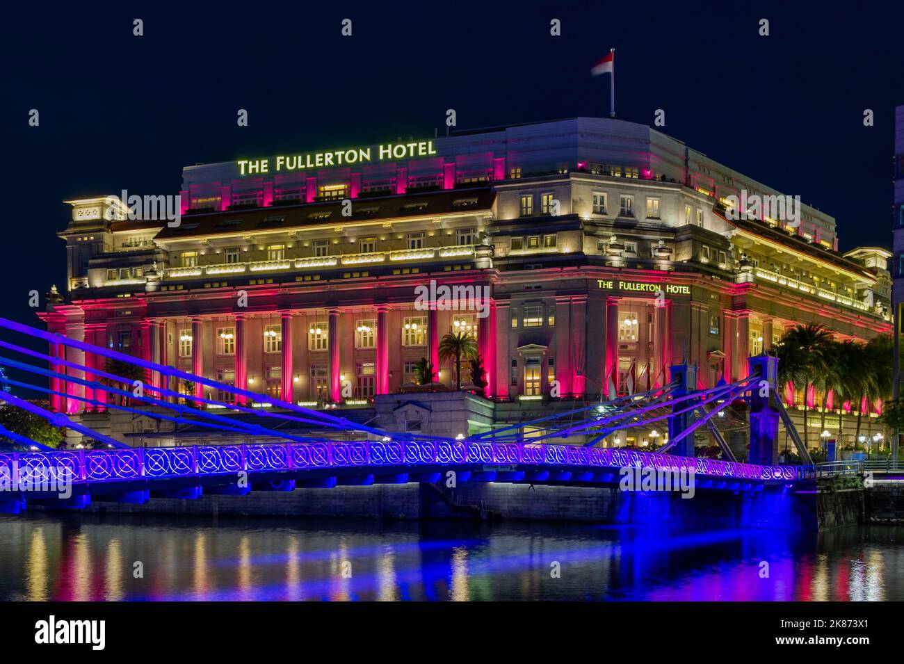 The Fullerton Hotel illuminated at night, Boat Quay, Singapore Stock ...