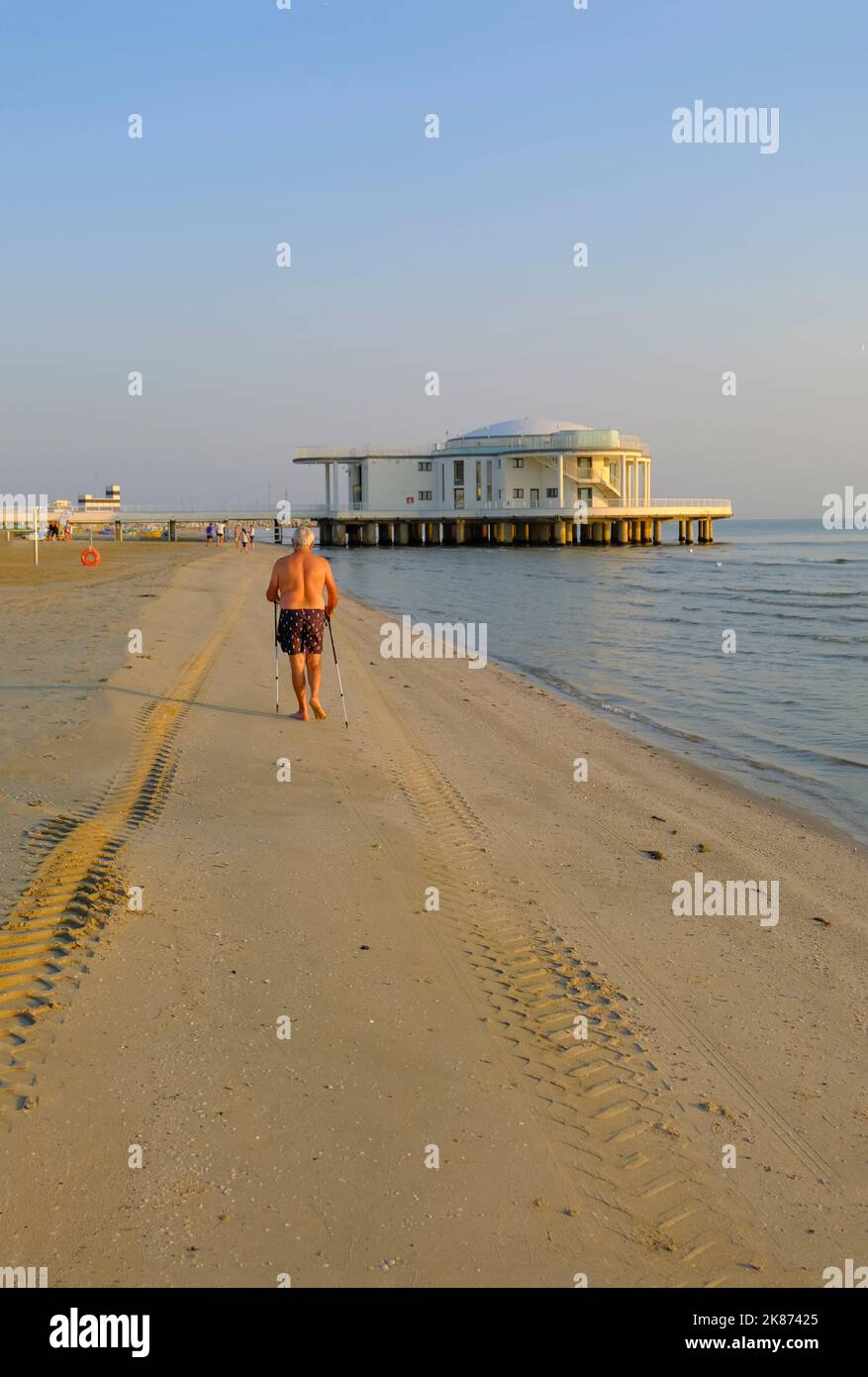 July 2022 Senigallia, Italy: Elder man walking with a stick towards ...