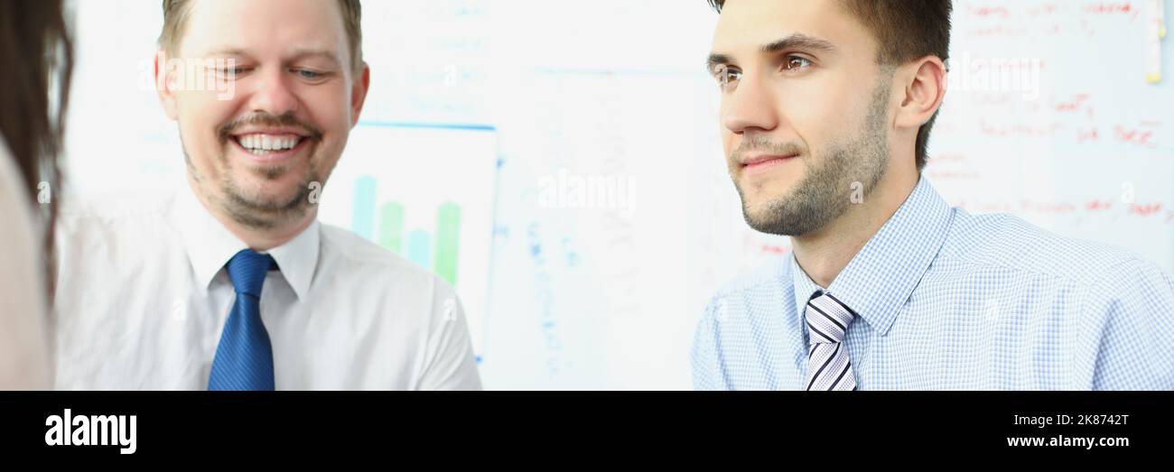 Group of business people with financial papers meet to solve problems ...