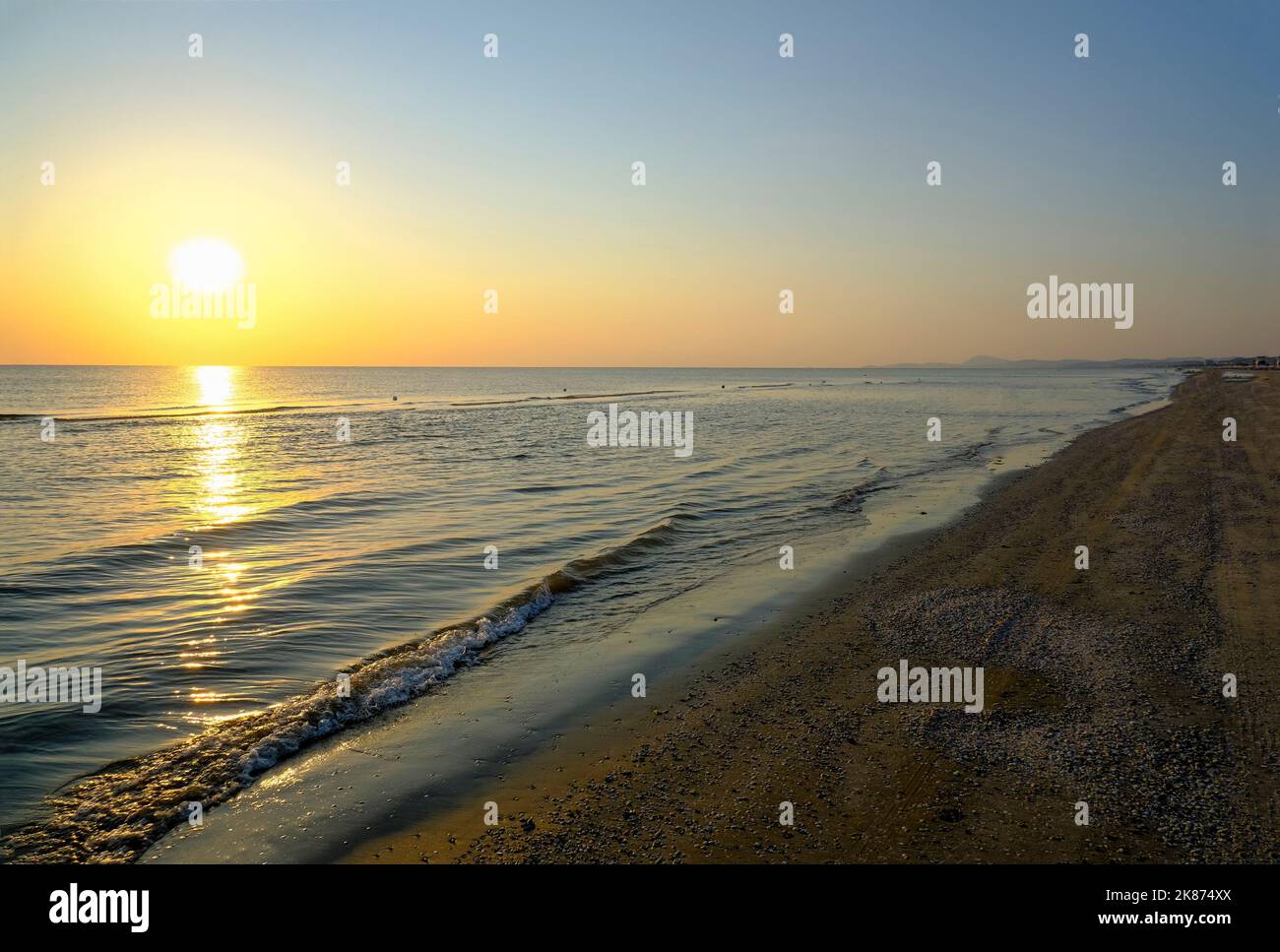 sunrise at the sandy beach. Coastline, horizontal line, natural ...