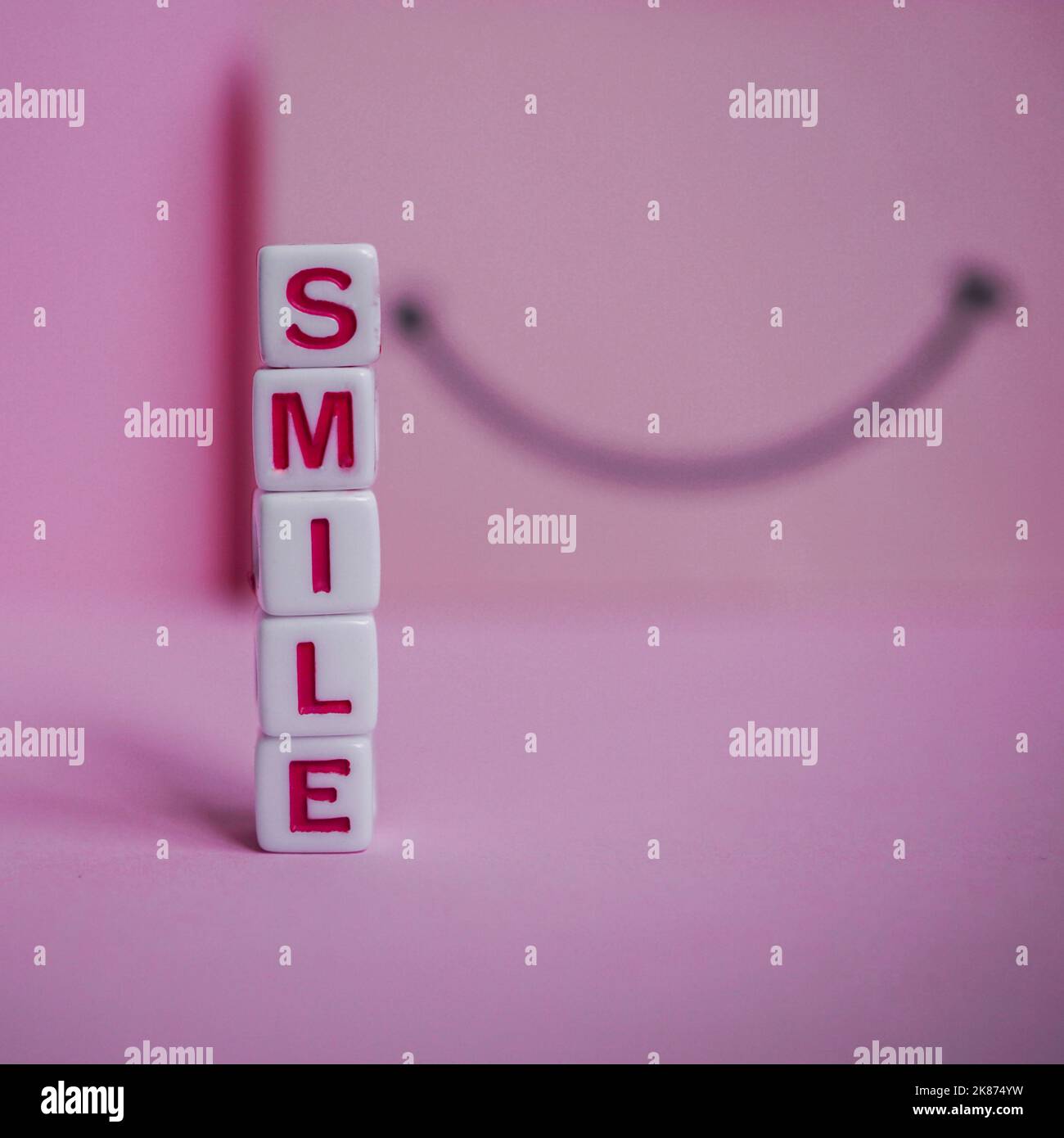 smile word with red cube letters, feelings and emotions Stock Photo - Alamy