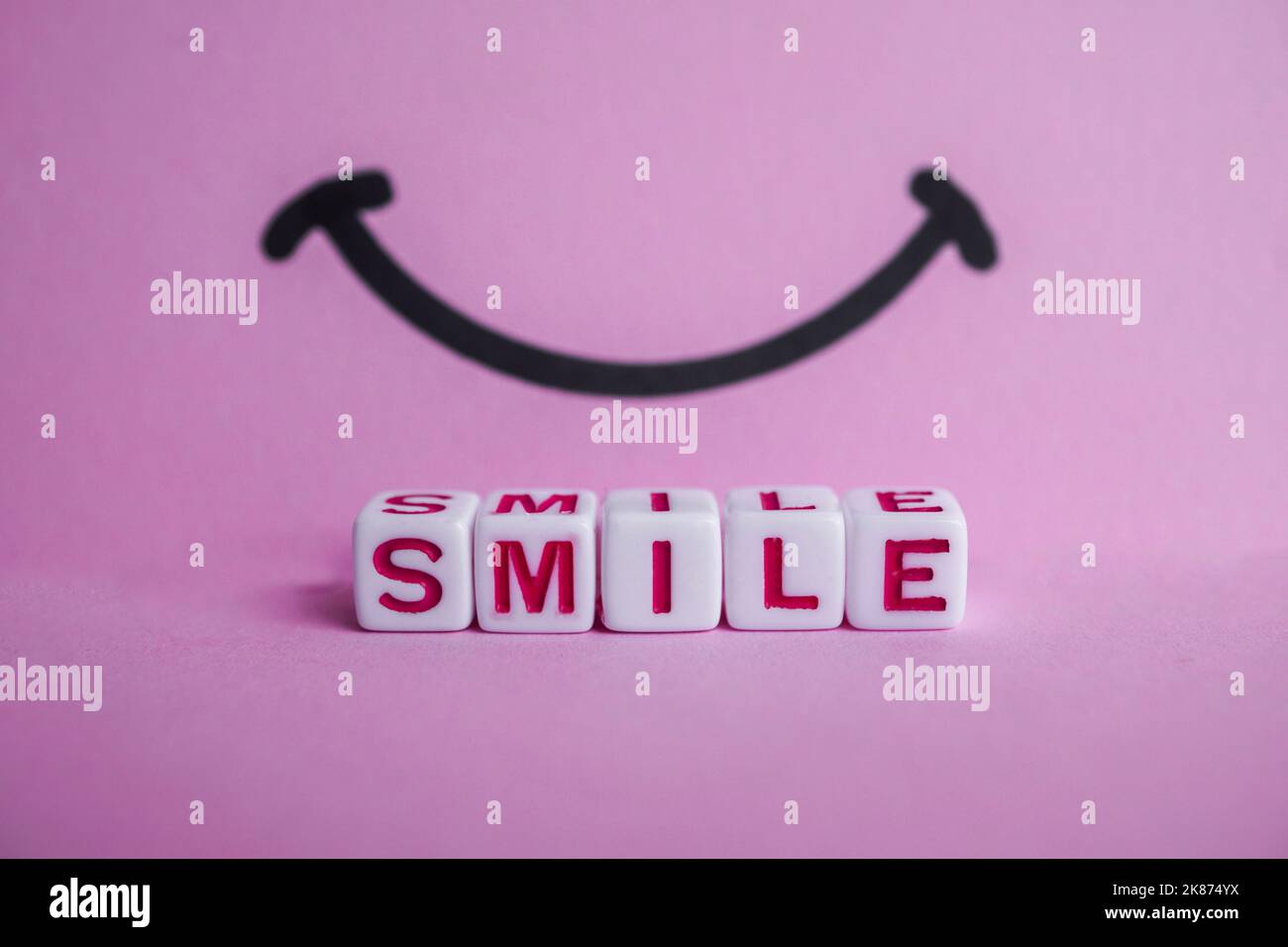smile word with red cube letters, feelings and emotions Stock Photo - Alamy