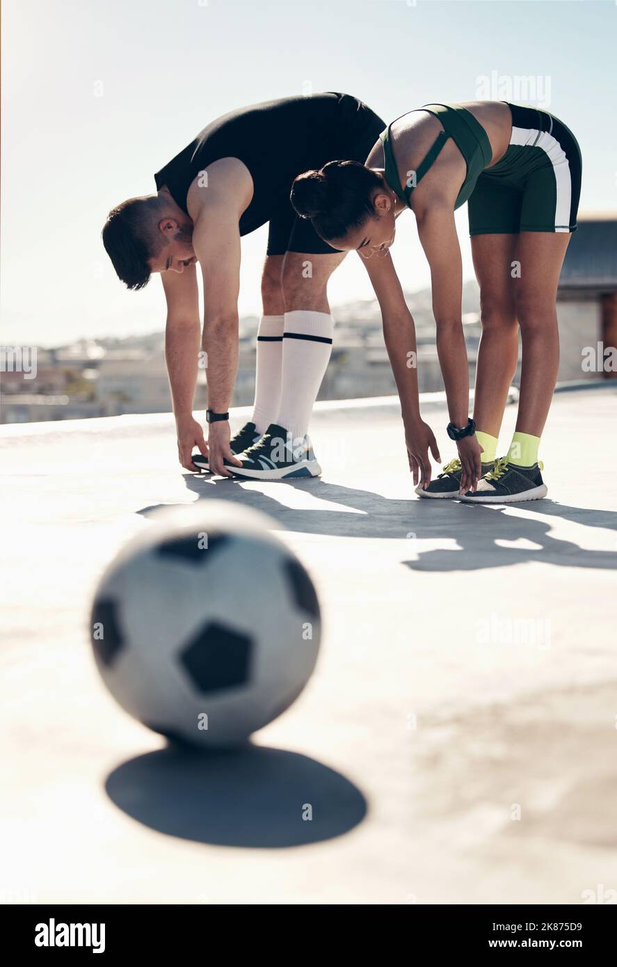 Athletes stretching, soccer player and couple workout on rooftop for ...