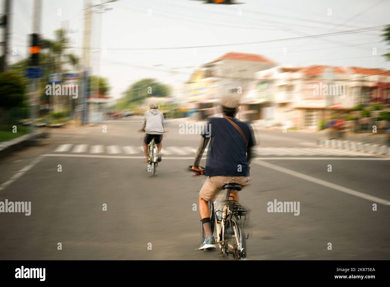 motion blur of two person riding bicycle in asian street Stock Photo ...