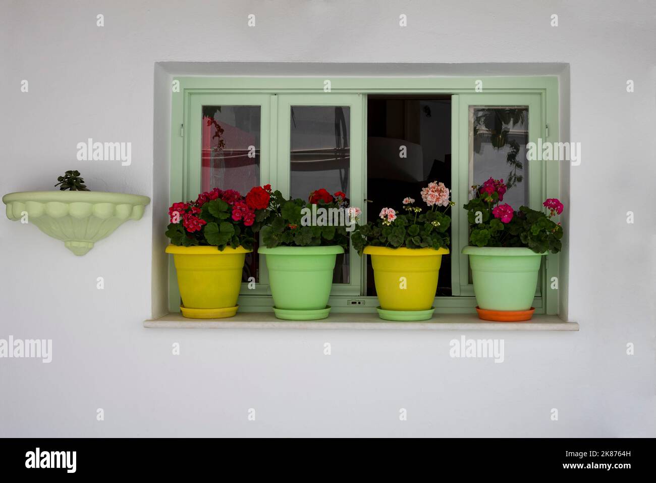Colourful pots on windowsill in Naxos Town, Naxos, the Cyclades, Aegean ...