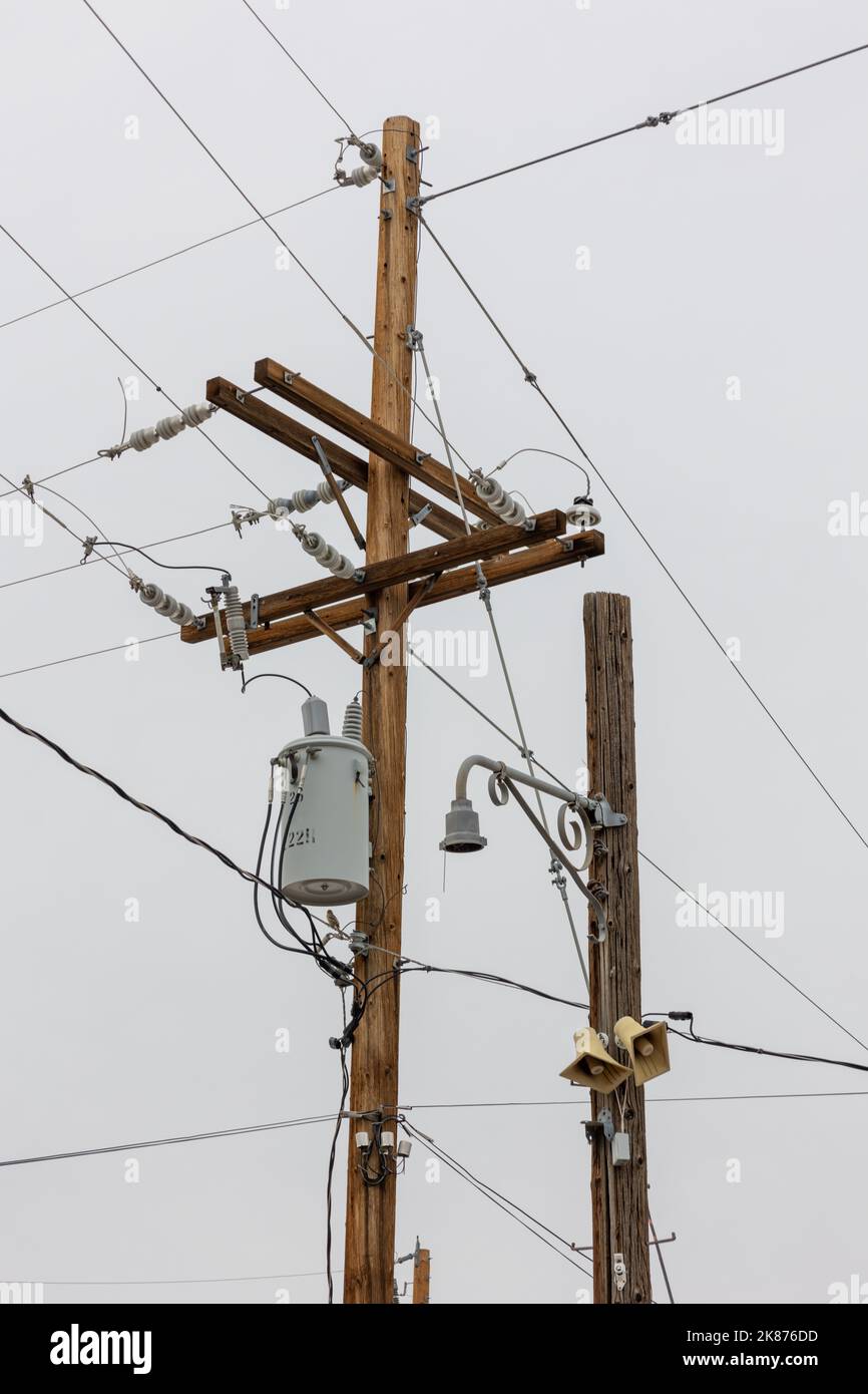 Old wooden utility poles with electrical wiring in the town of Oatman ...