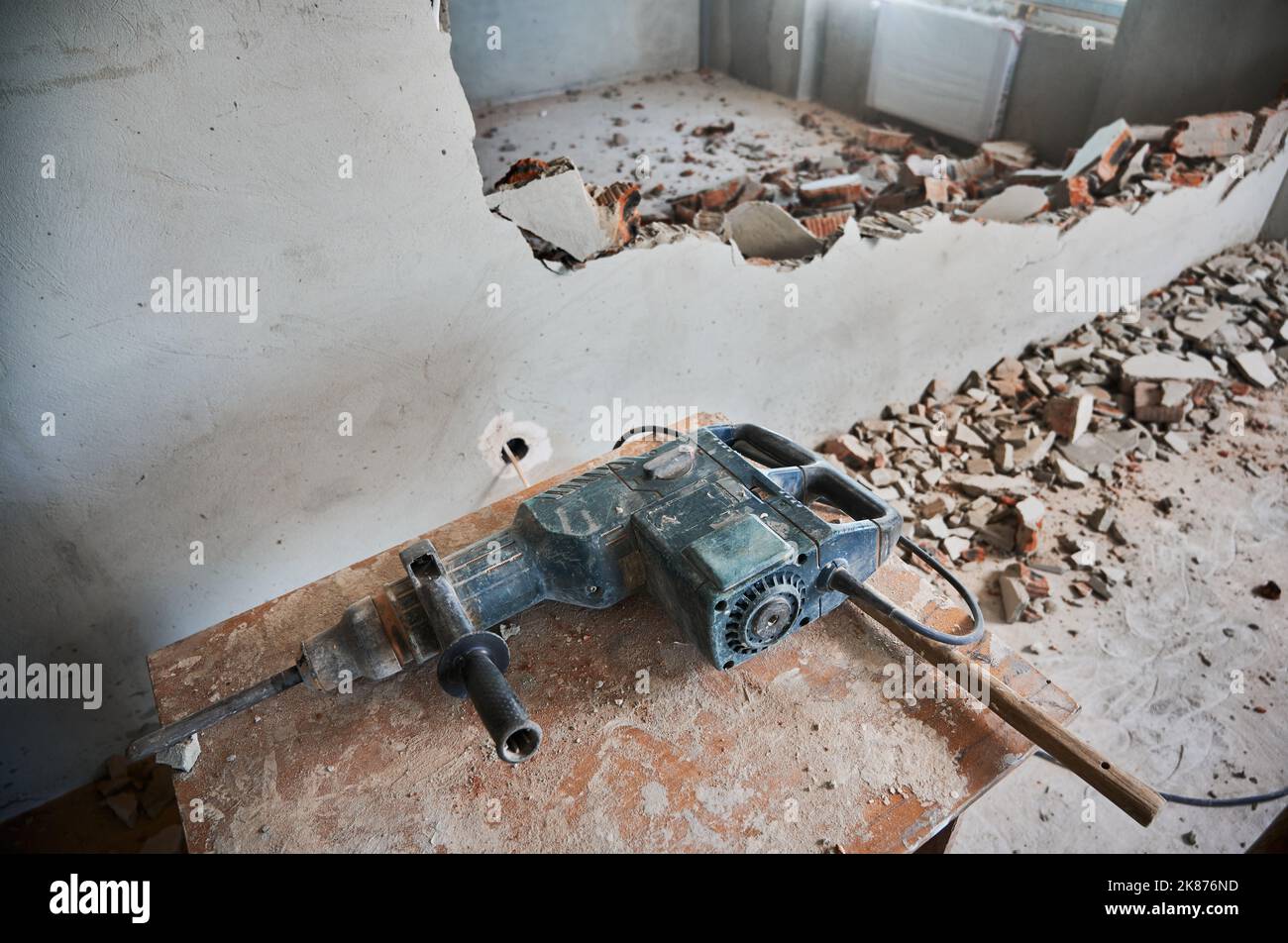 Wooden desk with electric hammer drill for construction and demolition ...