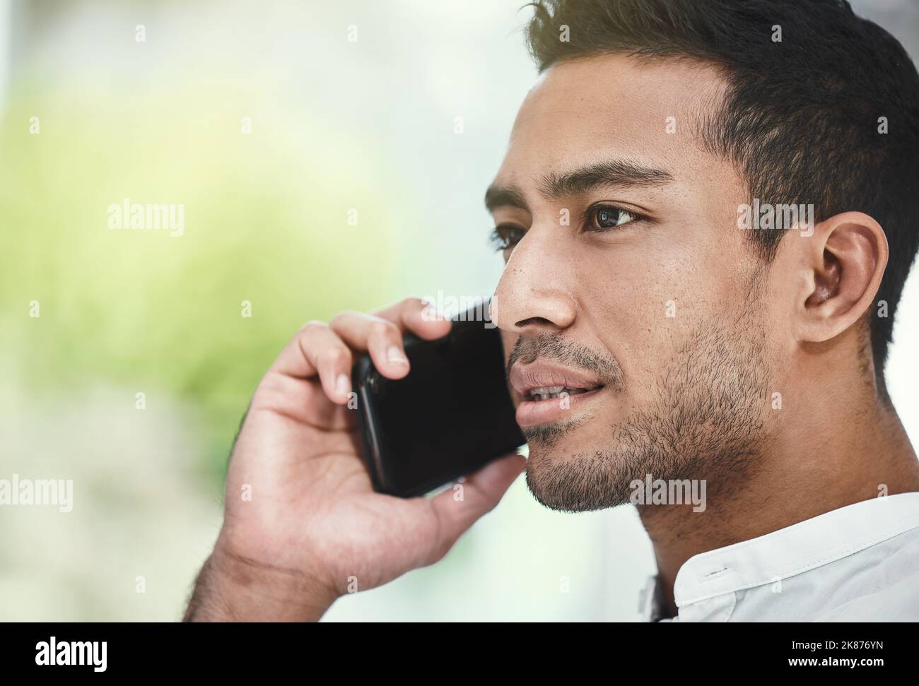 Yes, this is him speaking...Closeup shot of a businessman talking on ...