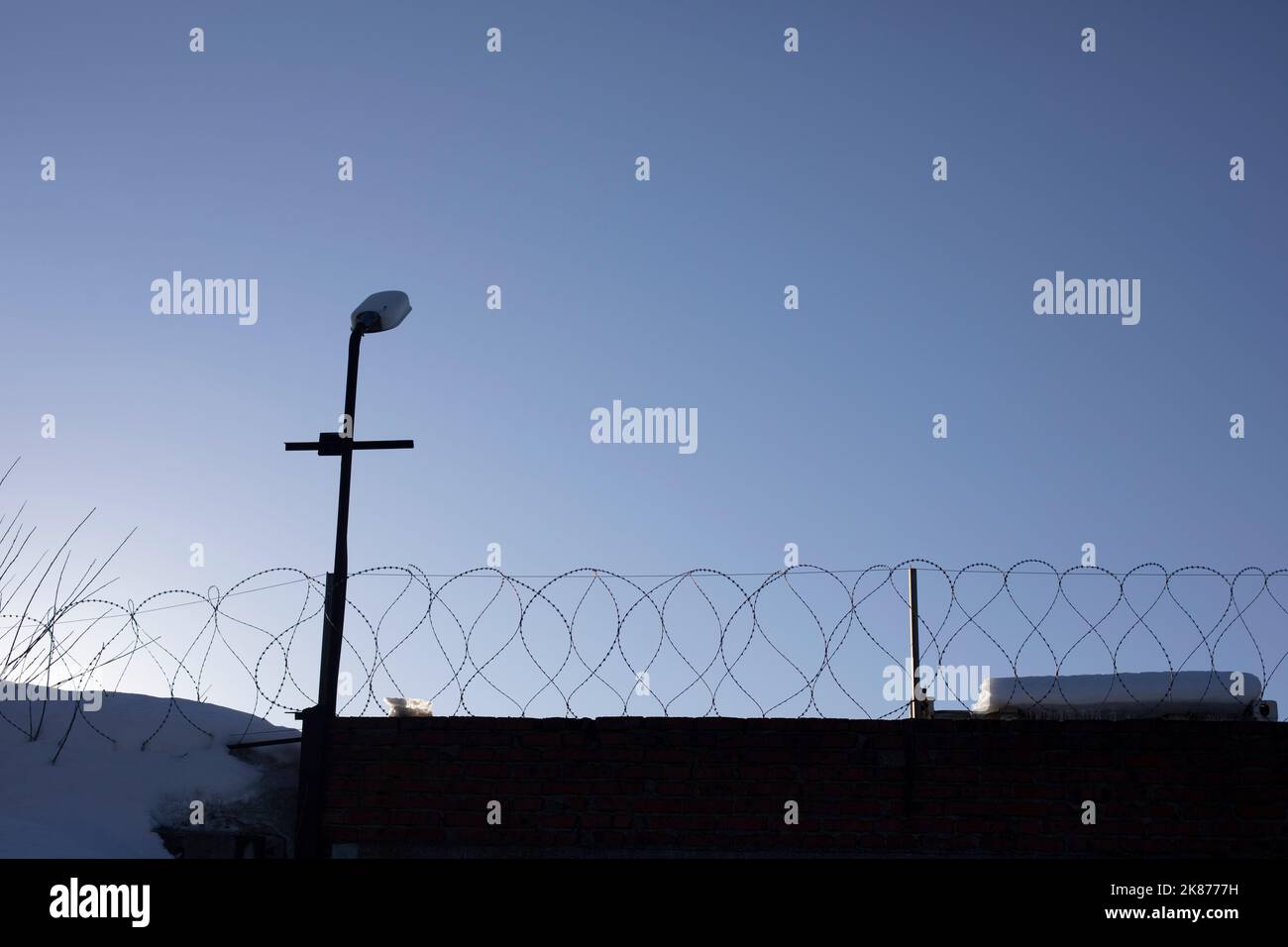 Barbed wire fence. Details of industrial area. Protection made of ...