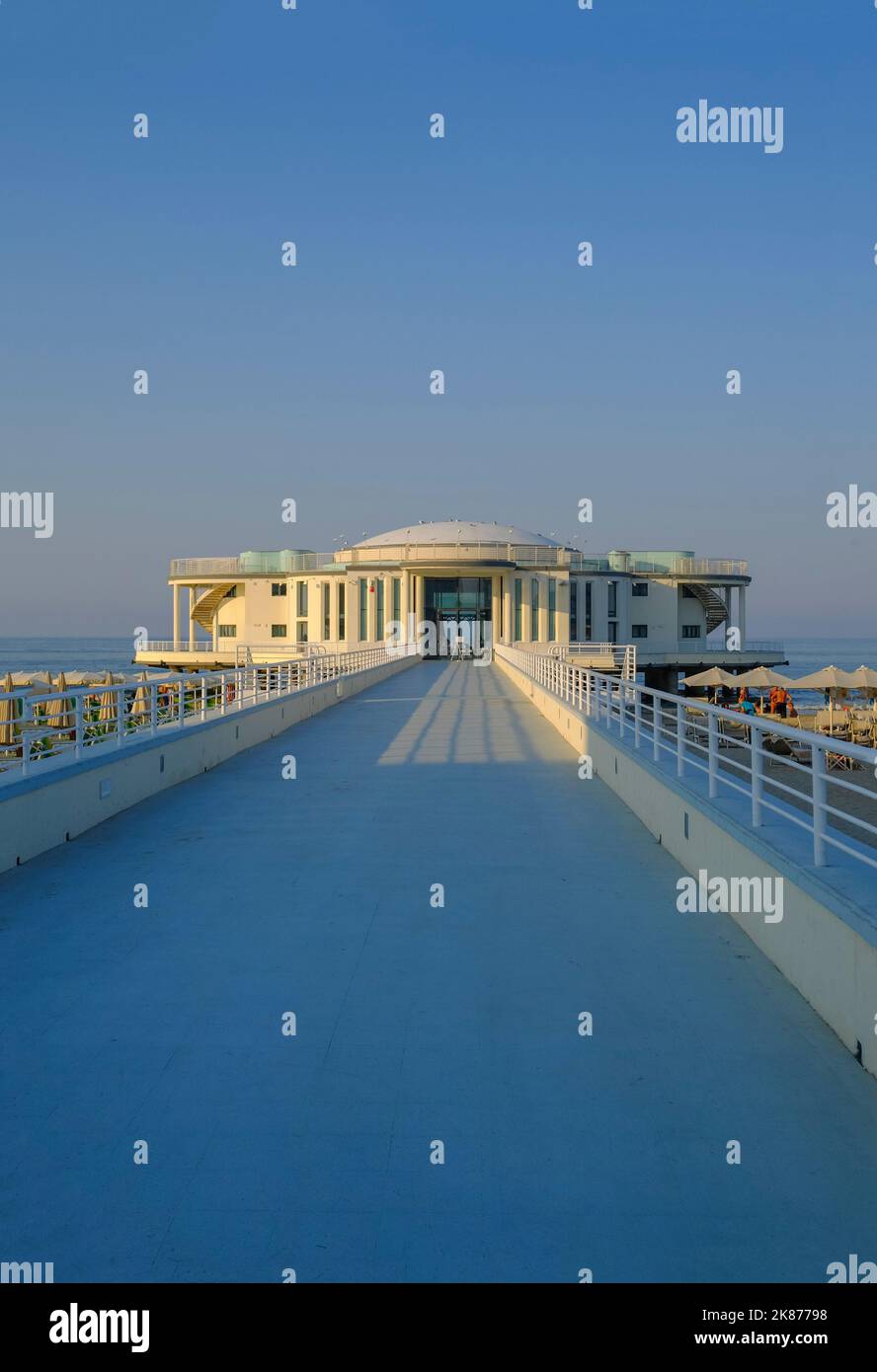 Rotonda al mare during sunrise across the sky and the beach with sun ...