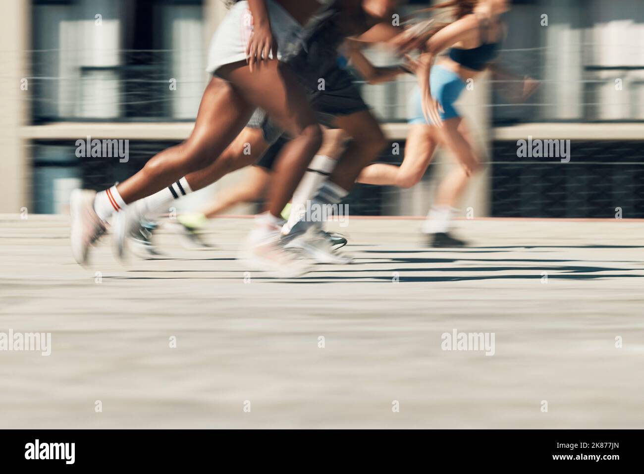 Running, motion and group of people on path together for marathon race ...