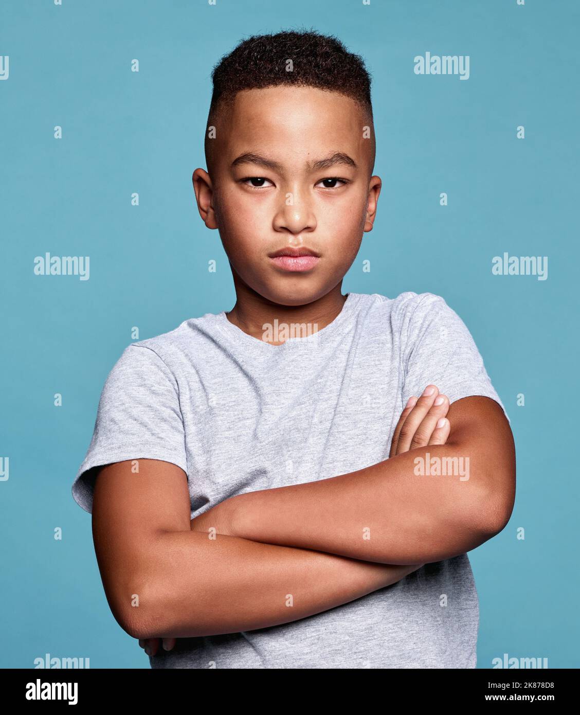 Problem, crossed arms and portrait of child with angry facial ...