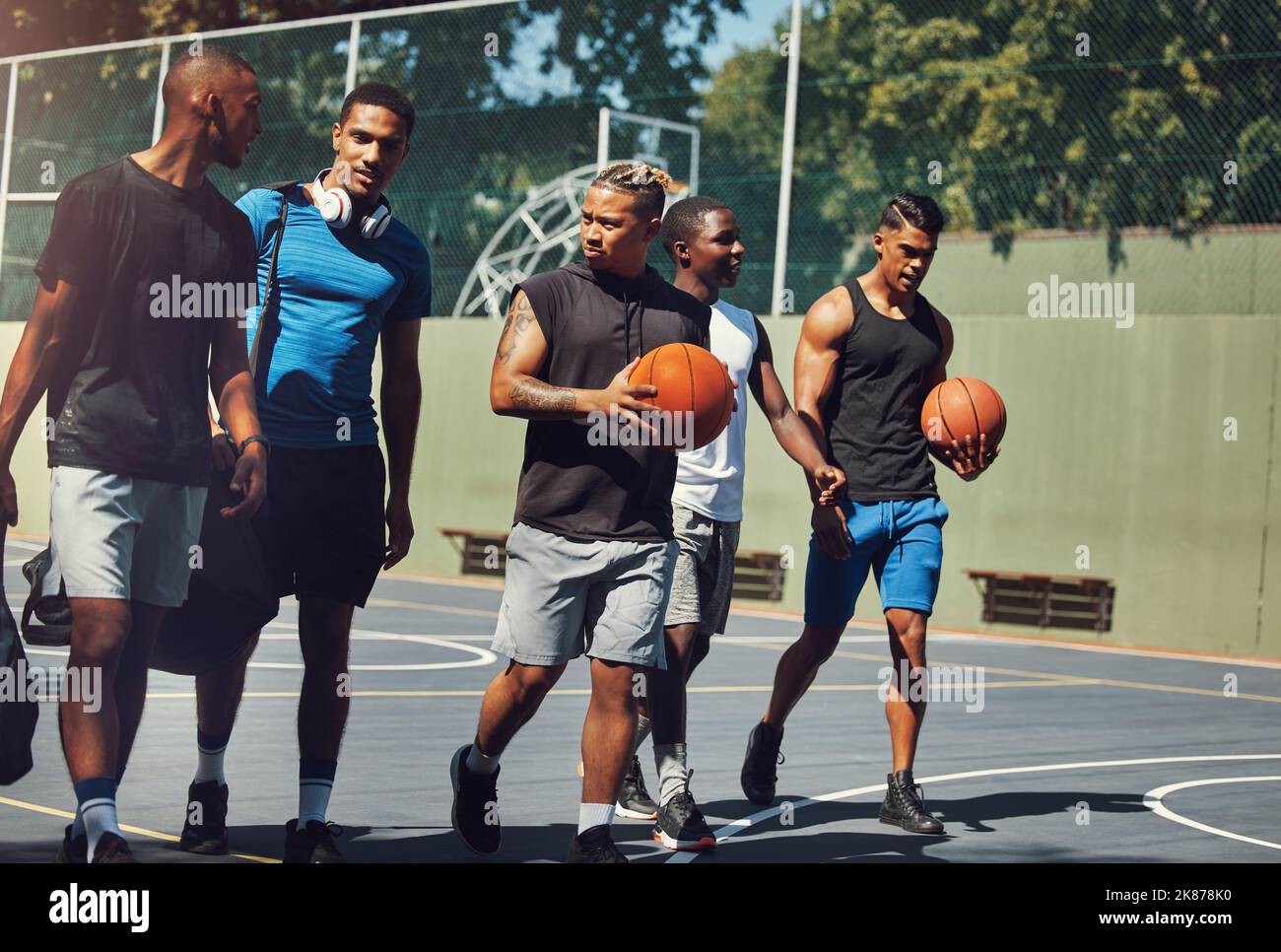 Sports, team and basketball player friends walking off together after ...