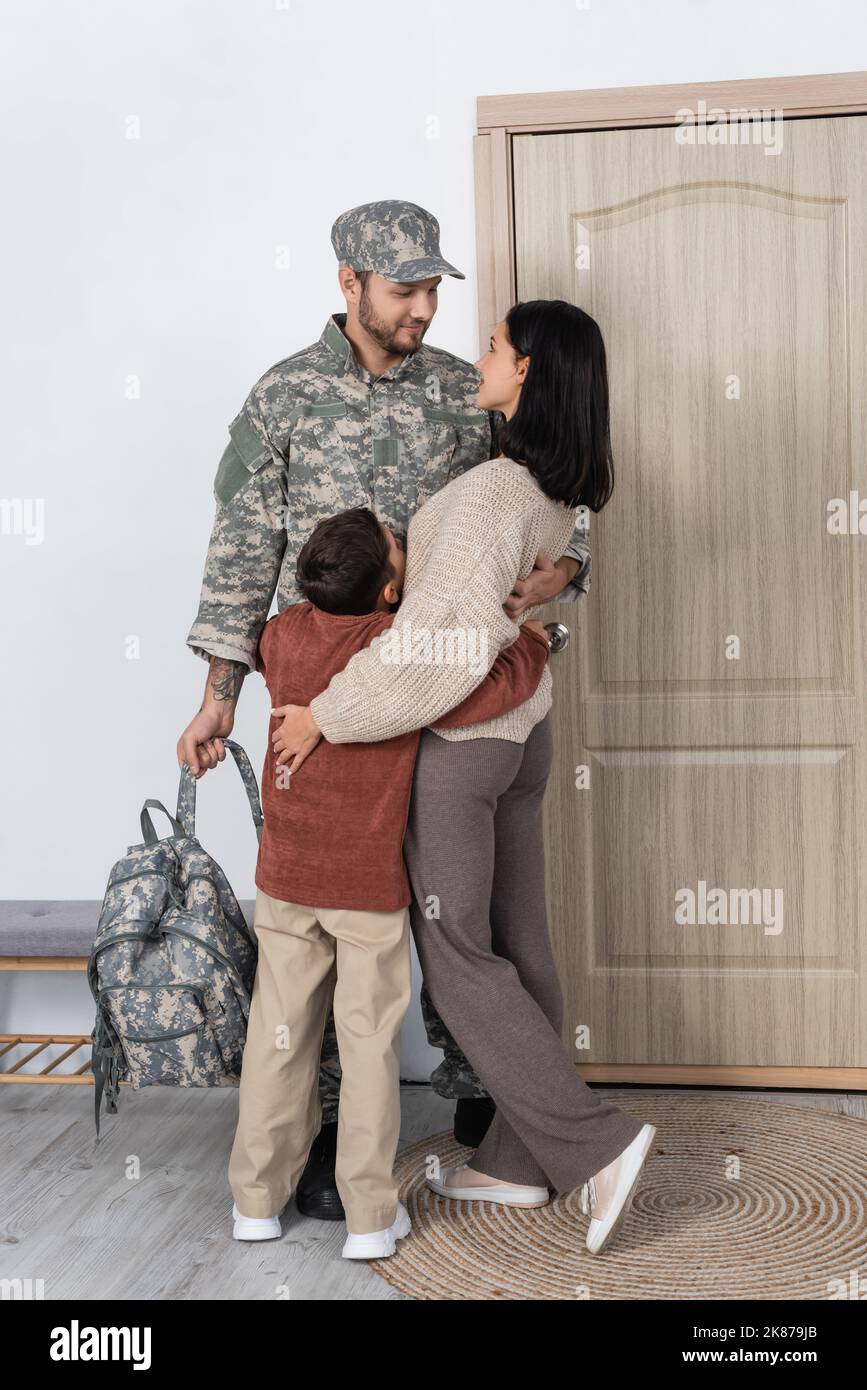 Mom hugging kid with backpack hi-res stock photography and images - Alamy