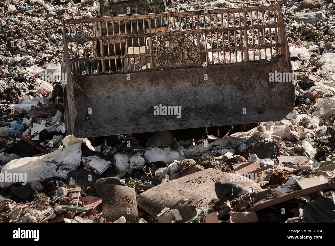 Heavy machinery shredding garbage in an open air landfill. Waste Stock ...