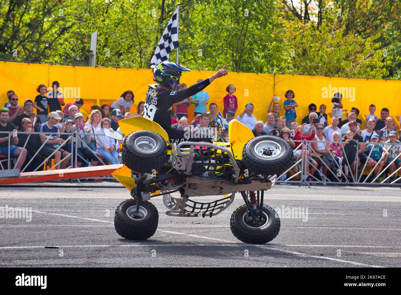 FRANKFURT AM MAIN, GERMANY - SEPT 2022: stuntman is riding quad bike ...