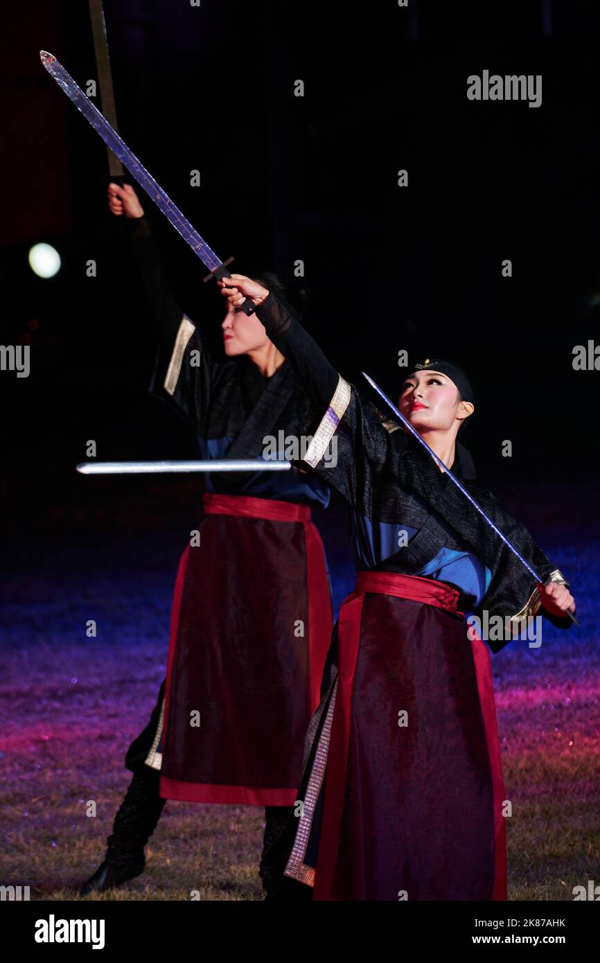 Suwon, Gyeonggi-do - 10 07 2022: Two women dance with swords in the ...